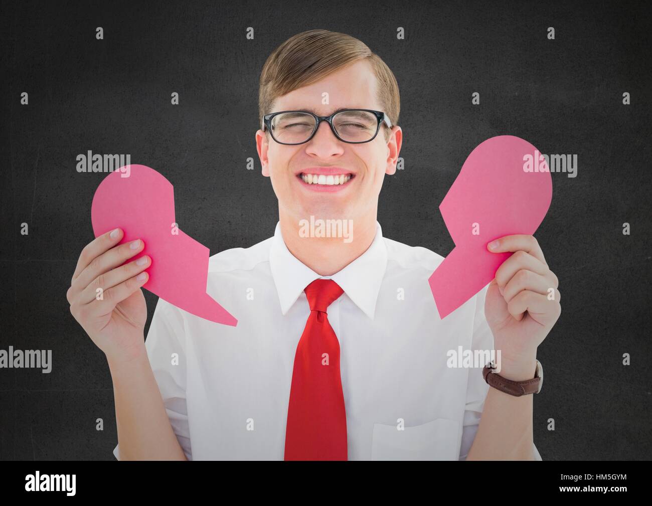 Crying man holding broken heart Stock Photo - Alamy