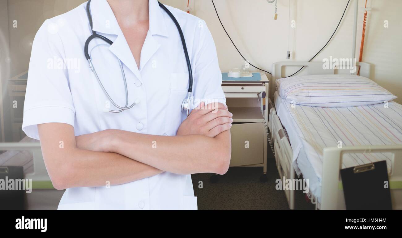 Mid section of doctor standing with arms crossed Stock Photo - Alamy