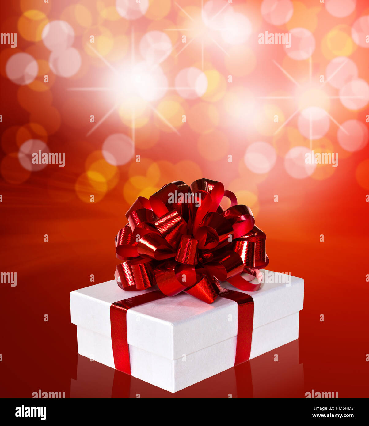 Gift in box with red ribbon and bow Stock Photo - Alamy