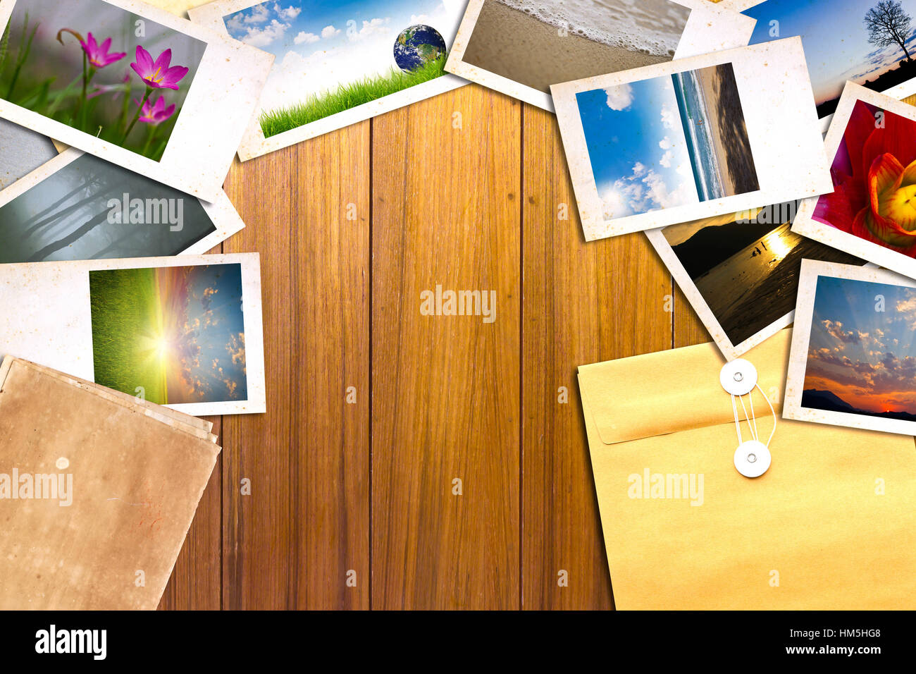 Old paper and photos on wooden table Stock Photo - Alamy