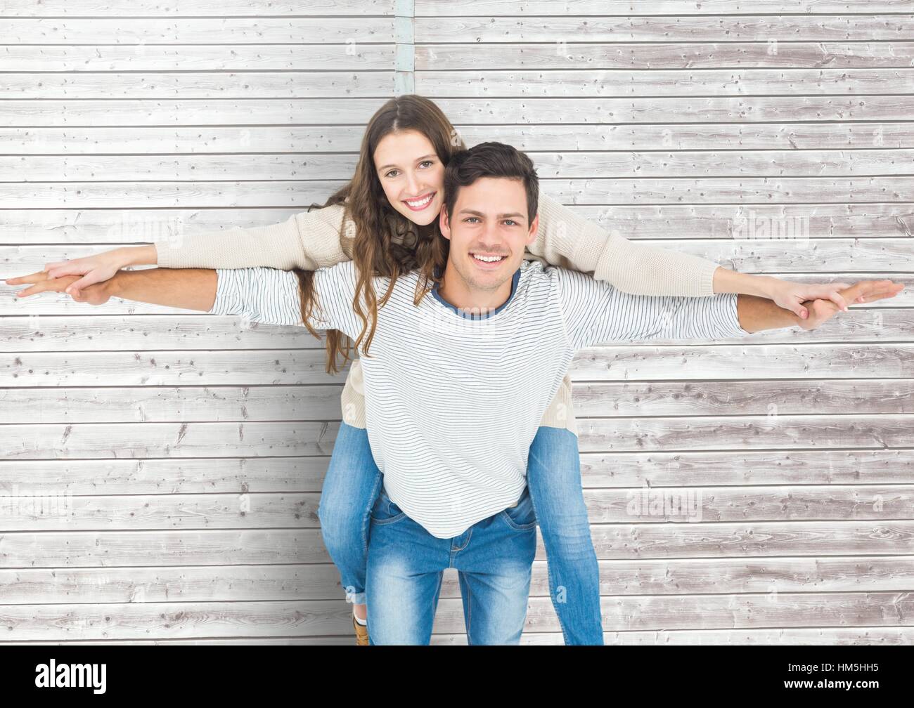 Man giving a piggyback ride to woman Stock Photo - Alamy
