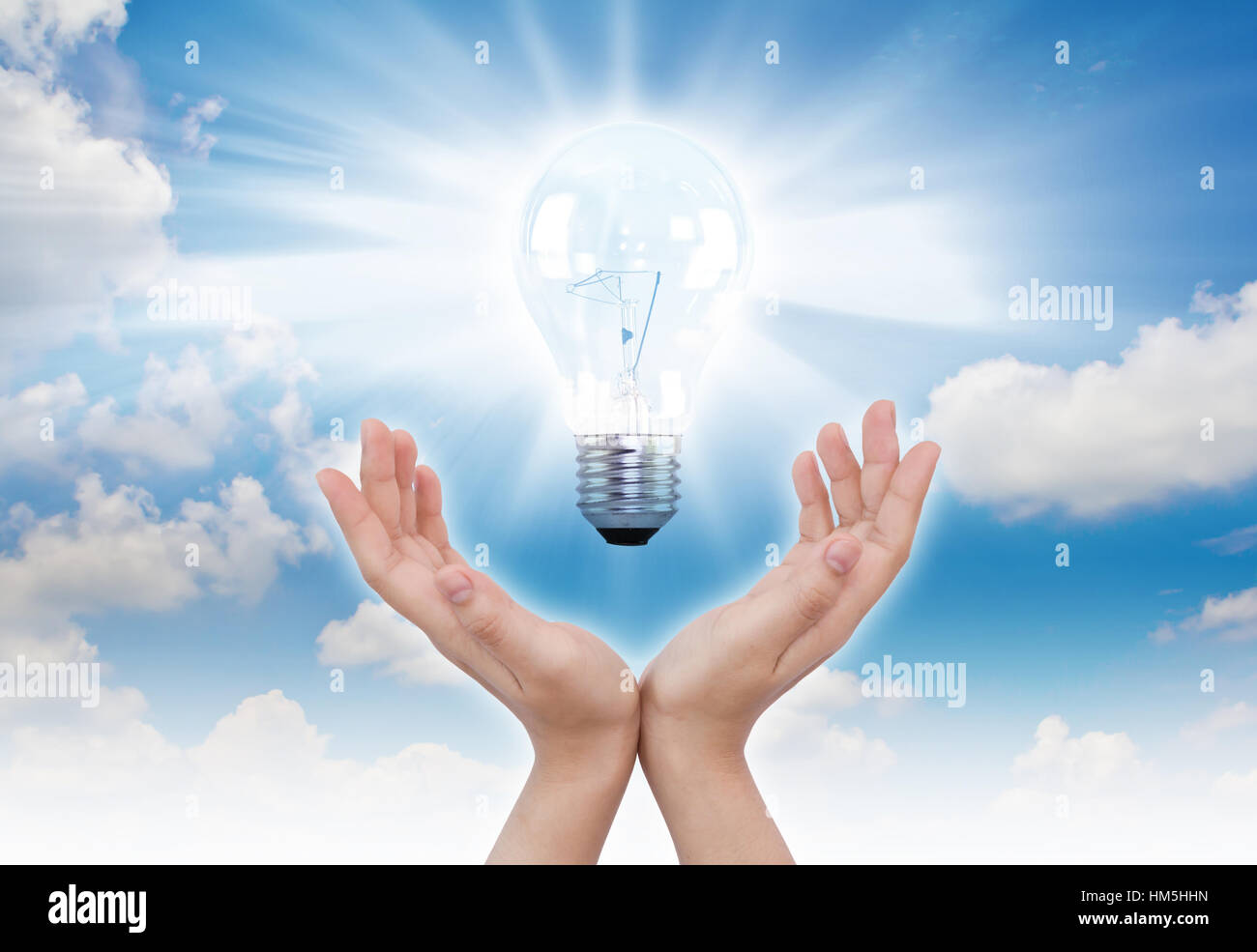 Light bulb in hand Stock Photo - Alamy