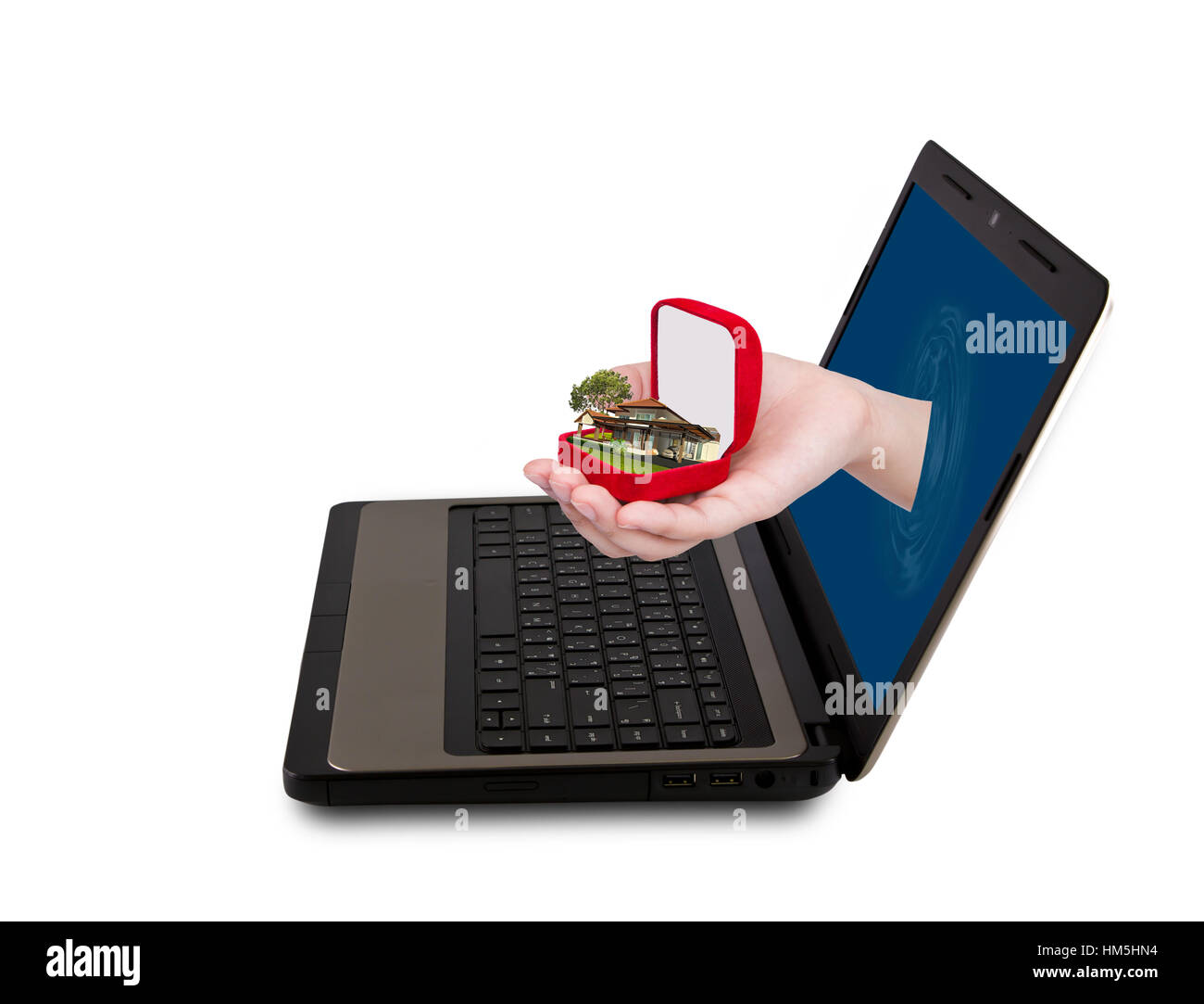 Hand giving a house from laptop screen Stock Photo - Alamy