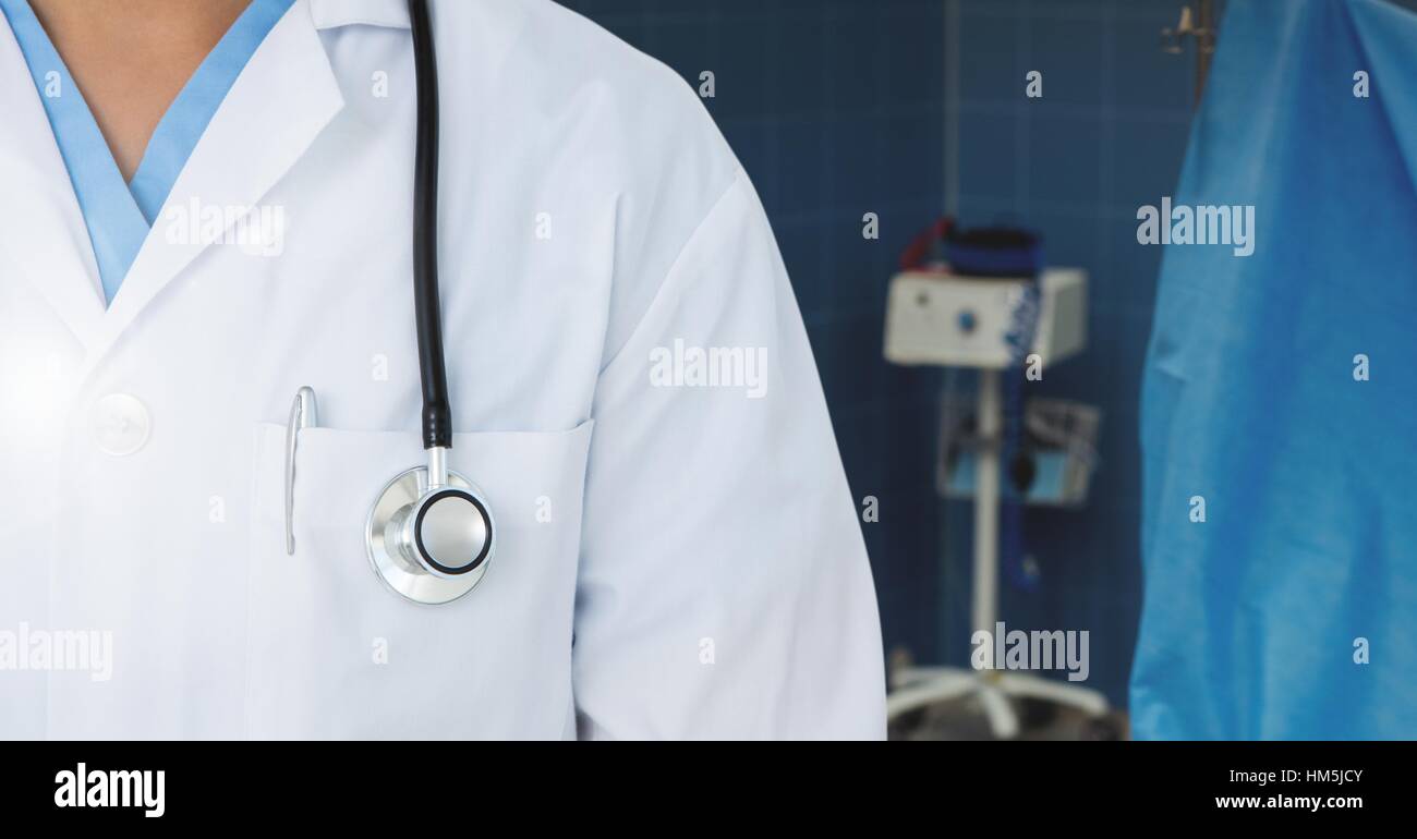 Doctor standing in operation room with stethoscope Stock Photo - Alamy