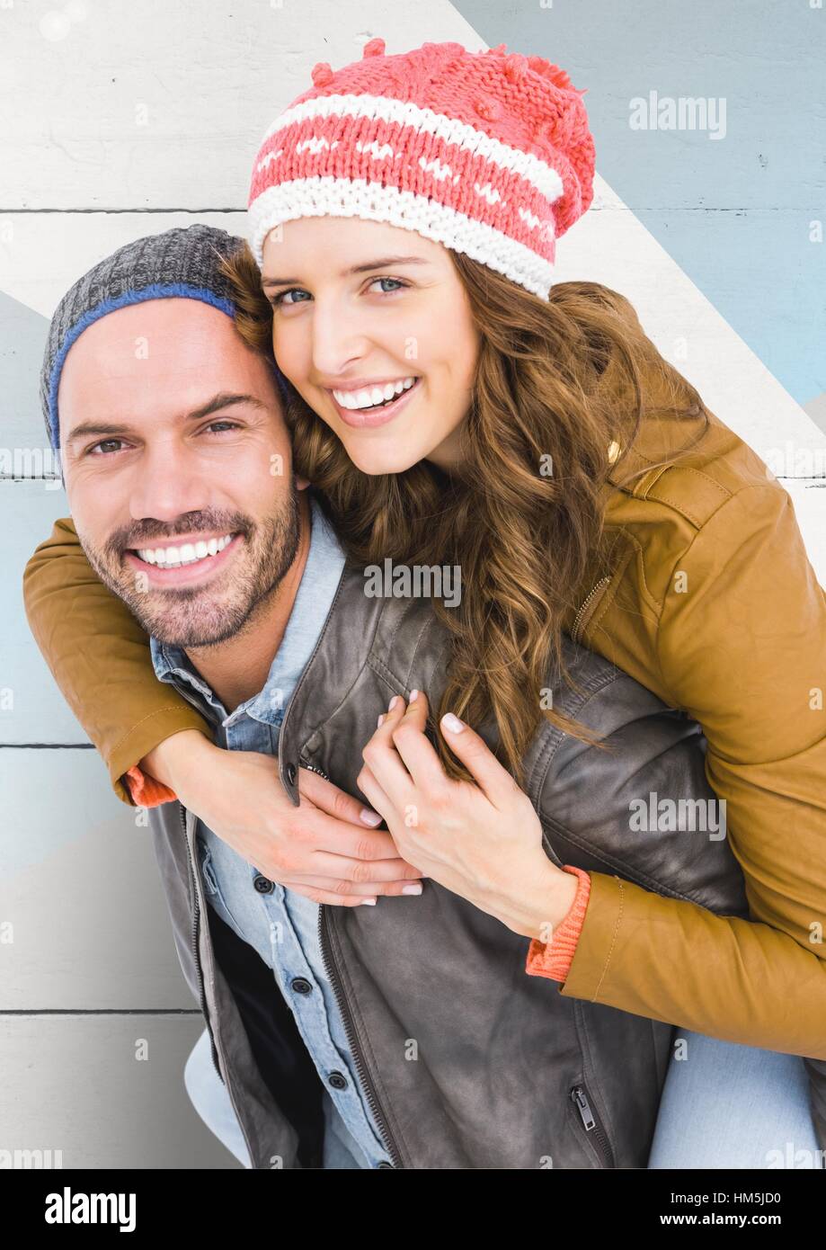 Portrait of happy man giving piggy back to woman Stock Photo - Alamy