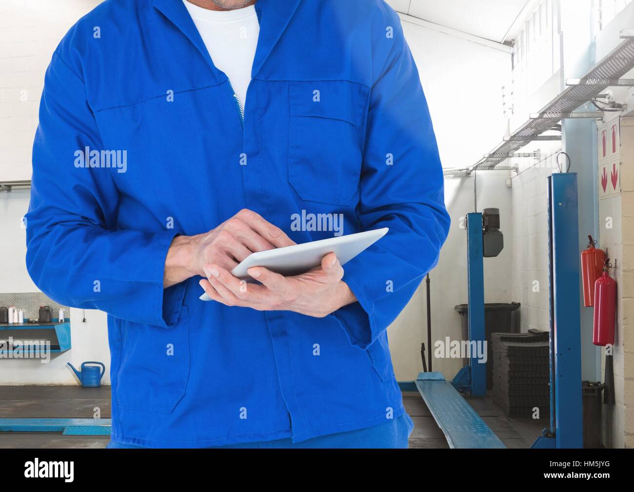 Mechanic using tablet in hi-res stock photography and images - Alamy