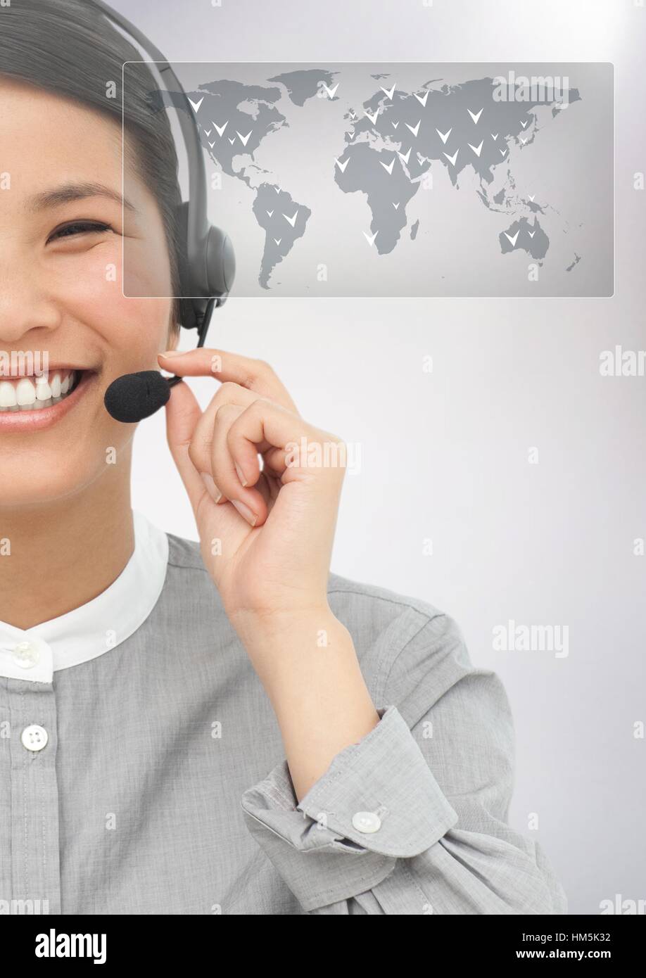 Female executive talking on headphones Stock Photo - Alamy