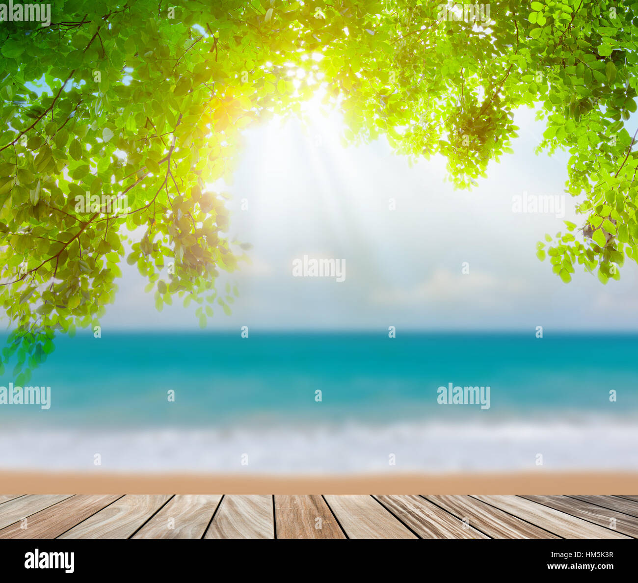 Wood terrace on the beach sea and sun light Stock Photo - Alamy