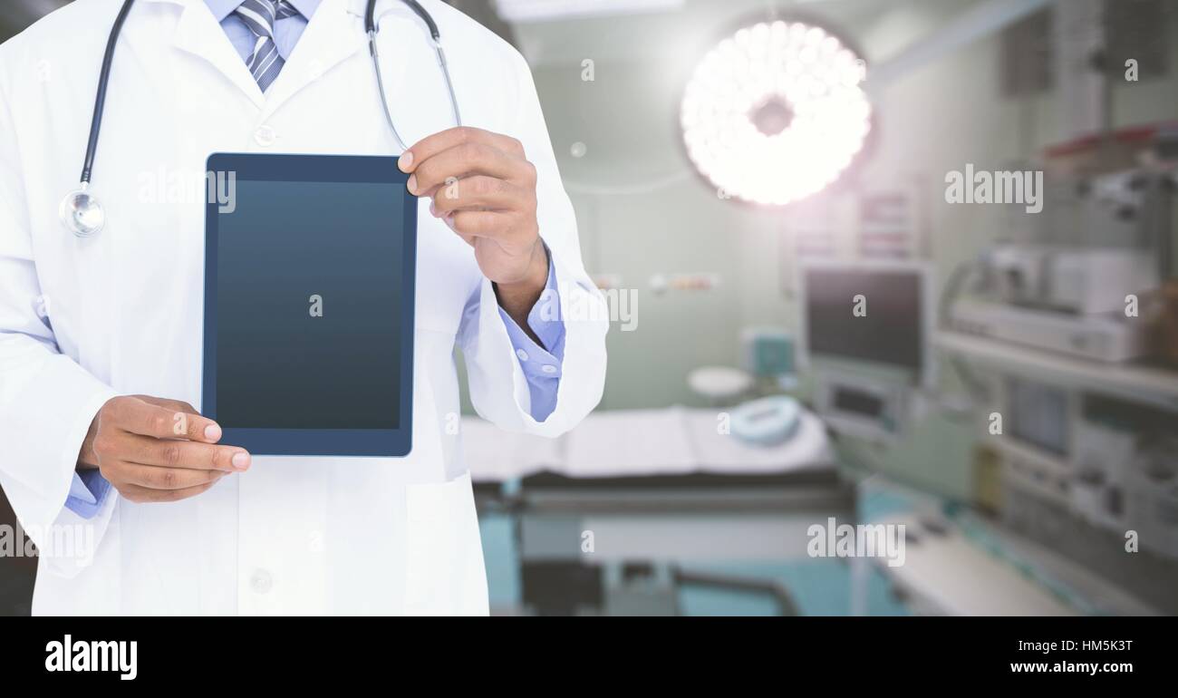 Mid section of doctor standing with digital tablet Stock Photo - Alamy
