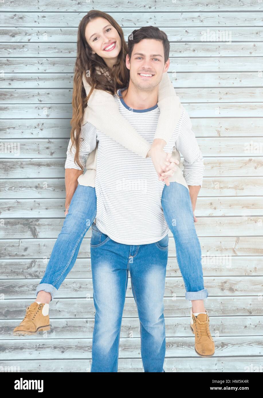 Man giving piggyback ride to woman Stock Photo - Alamy