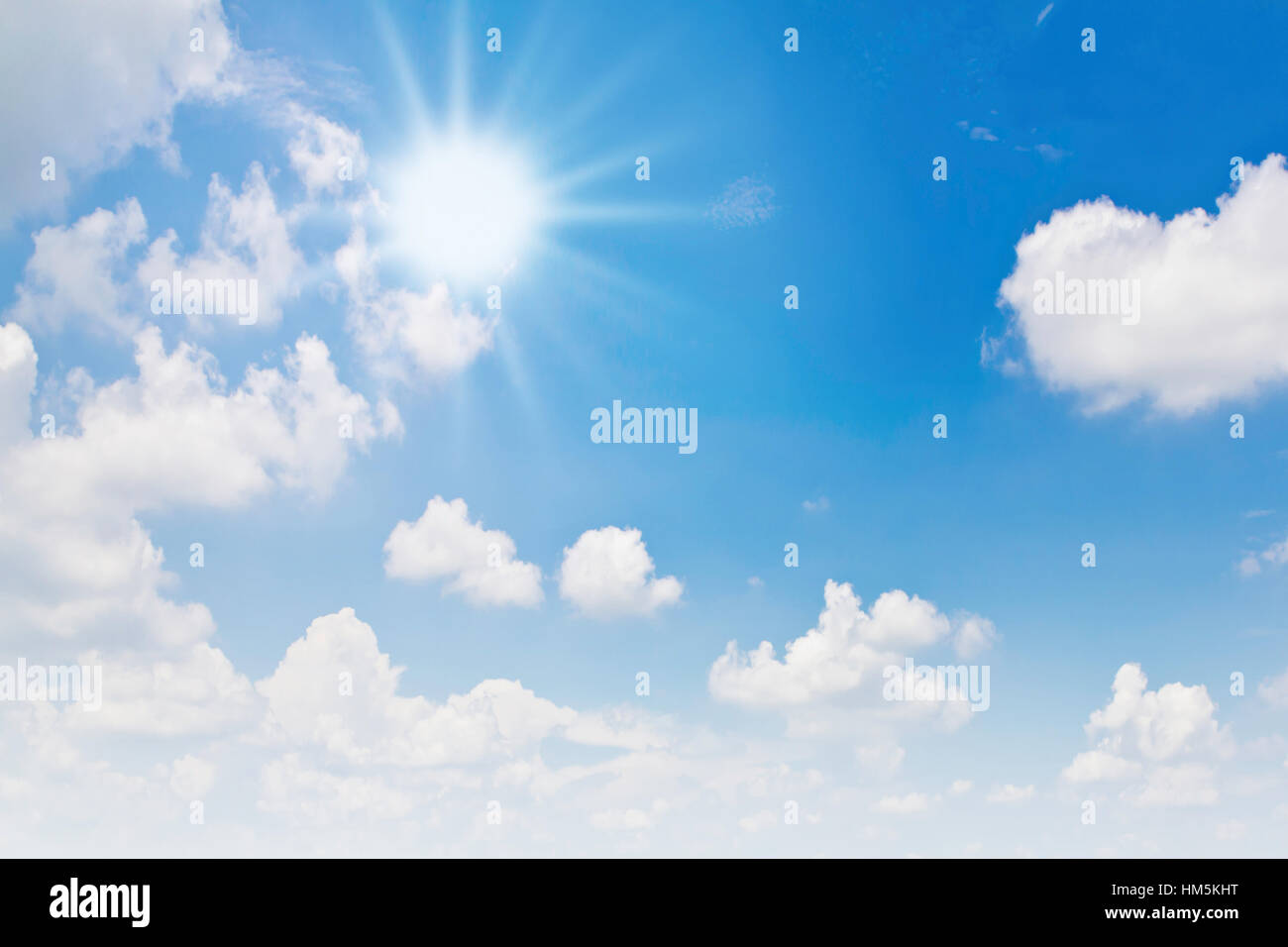 Blue sky with sun and beautiful clouds Stock Photo - Alamy