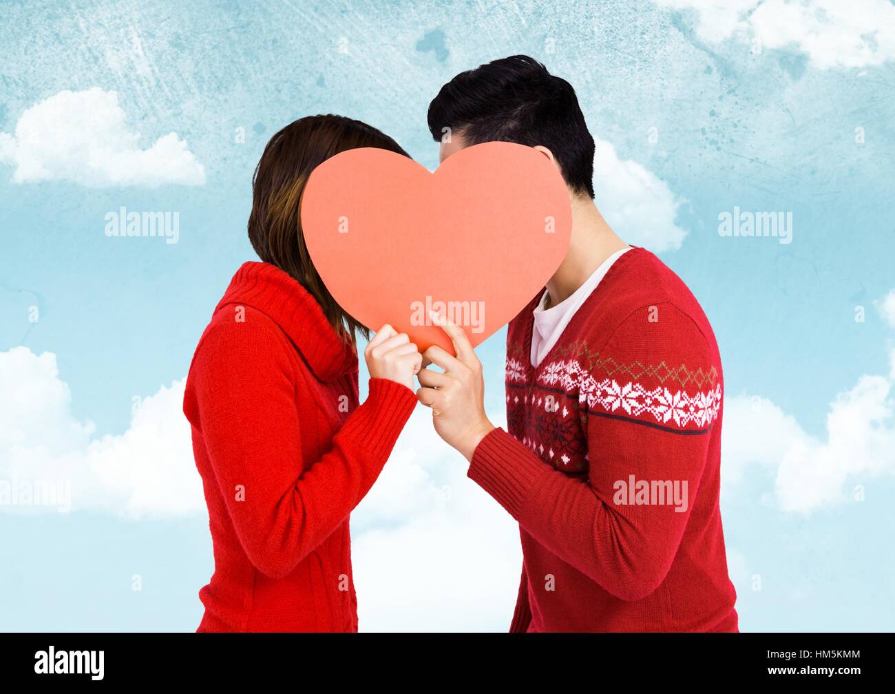 Romantic couple holding heart shape and kissing each other Stock Photo ...