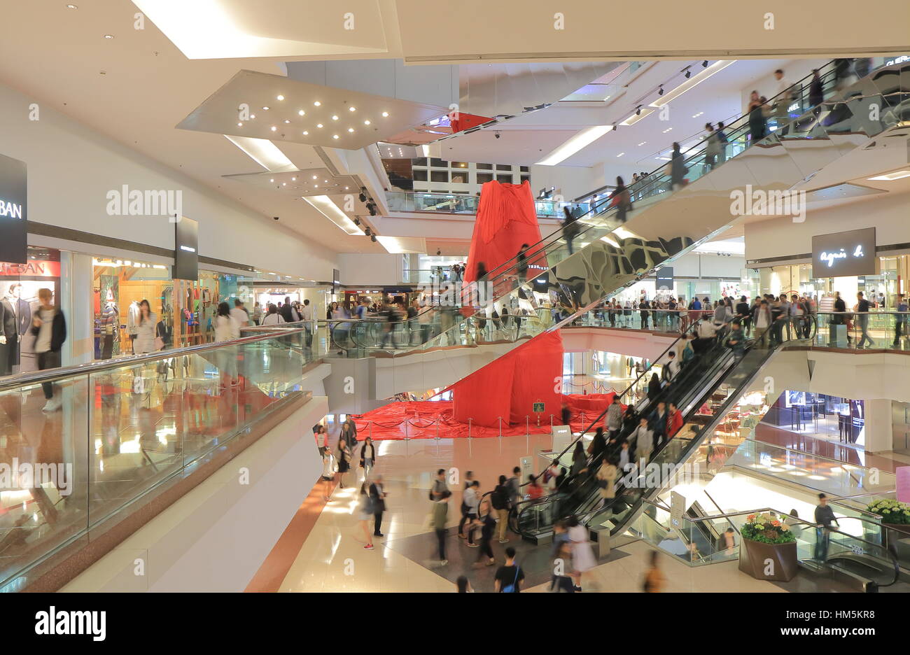 People visit Festival Walk in Hong Kong. Festival Walk was once the ...