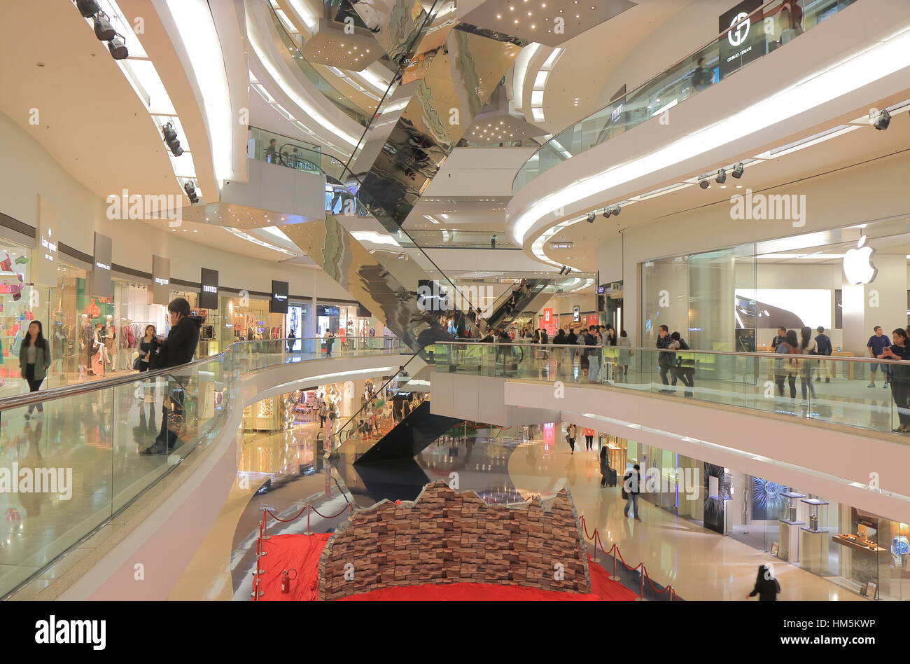 People visit Festival Walk in Hong Kong. Festival Walk was once the ...
