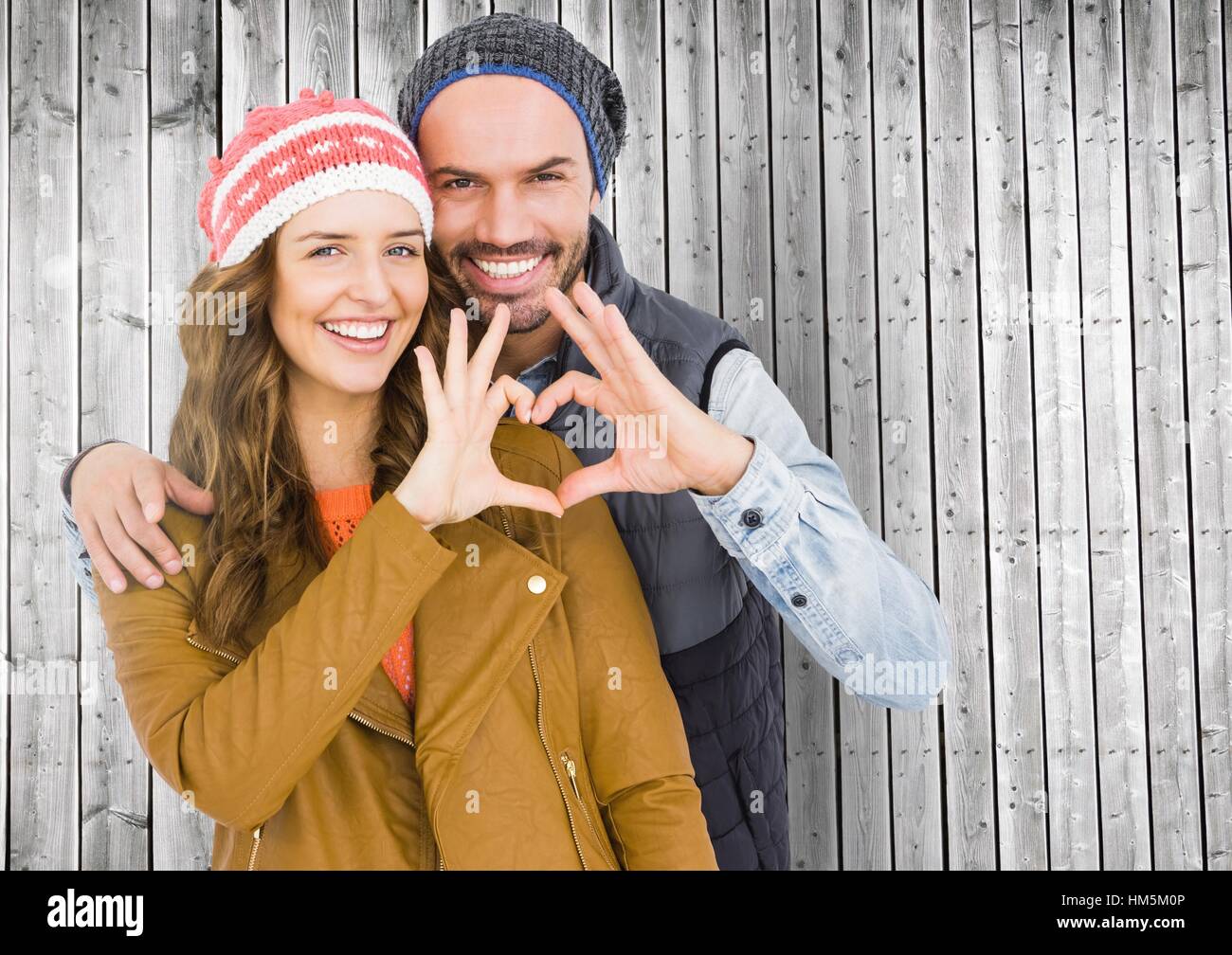 Portrait of happy couple forming a heart shape with hands Stock Photo ...