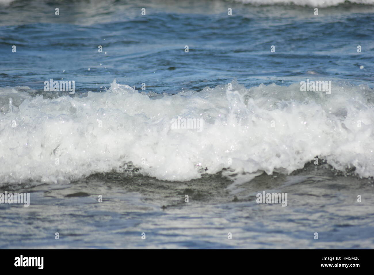 Waves on the beach Stock Photo - Alamy