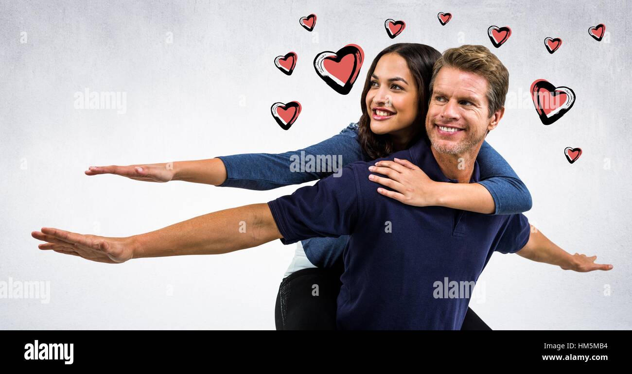 Man giving a piggyback ride to woman Stock Photo - Alamy