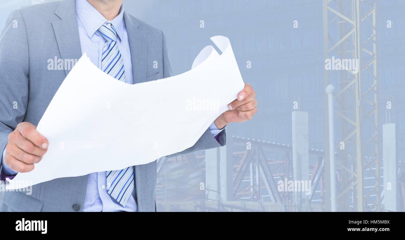 Architecture holding blueprint Stock Photo - Alamy