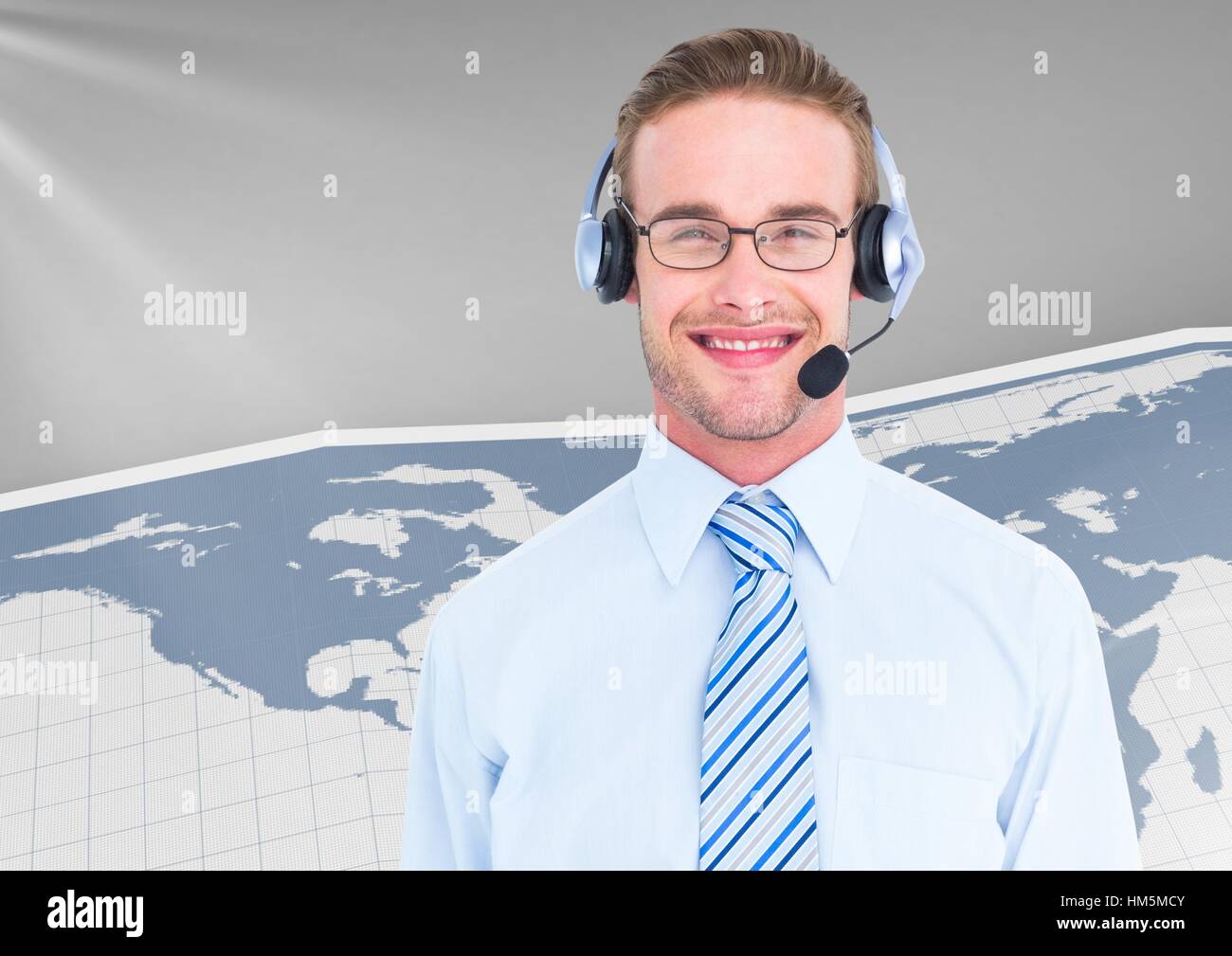 Call center executive with headset smiling with world map in background ...