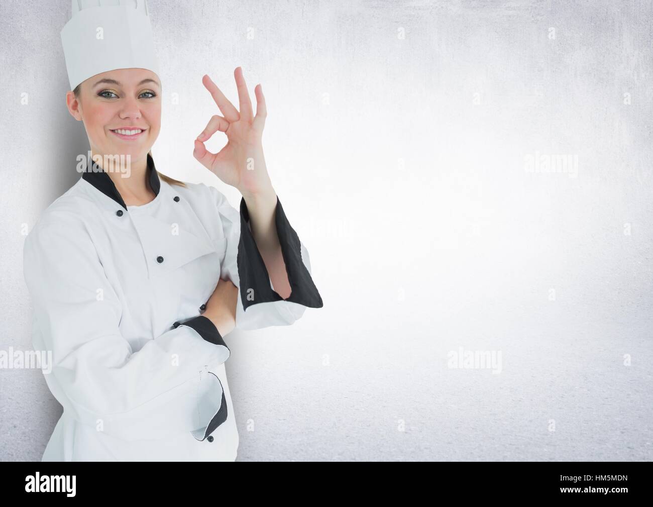 Portrait of smiling female chef cook showing ok sign Stock Photo - Alamy