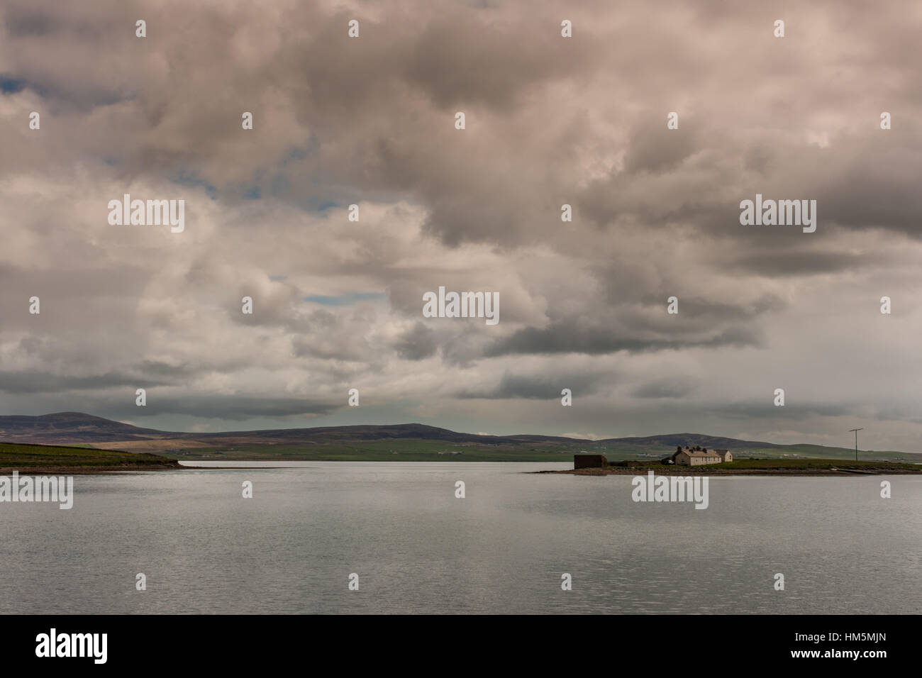 The inlet from Atlantic Ocean into Stromness harbor Stock Photo - Alamy