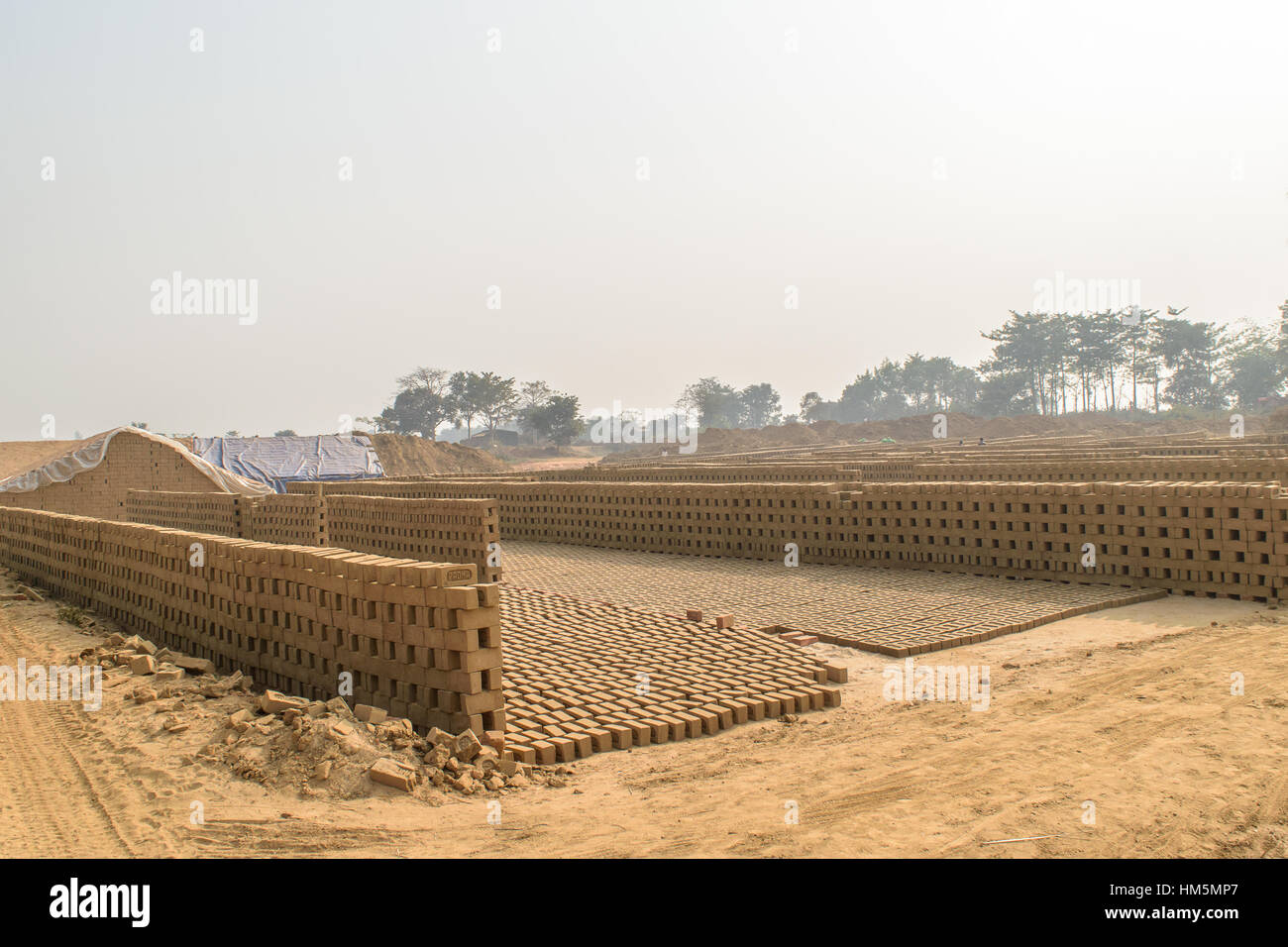 Bricks are arranged for dry up in the sunlight at the brick making ...