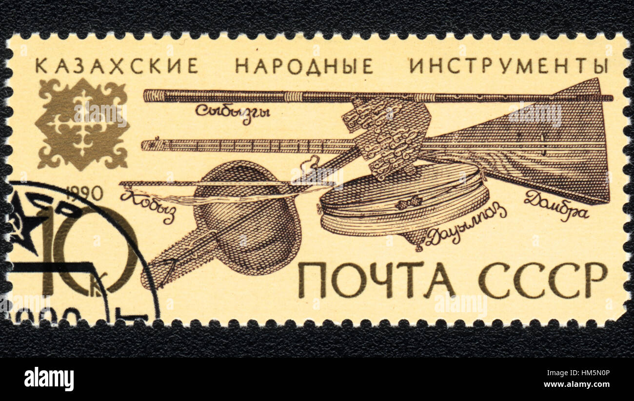 A postage stamp printed in USSR shows Kazakh folk musical instruments ...