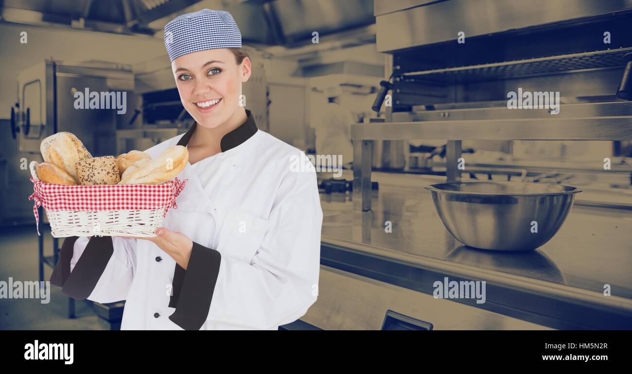 Smiling female chef presenting food in kitchen Stock Photo - Alamy
