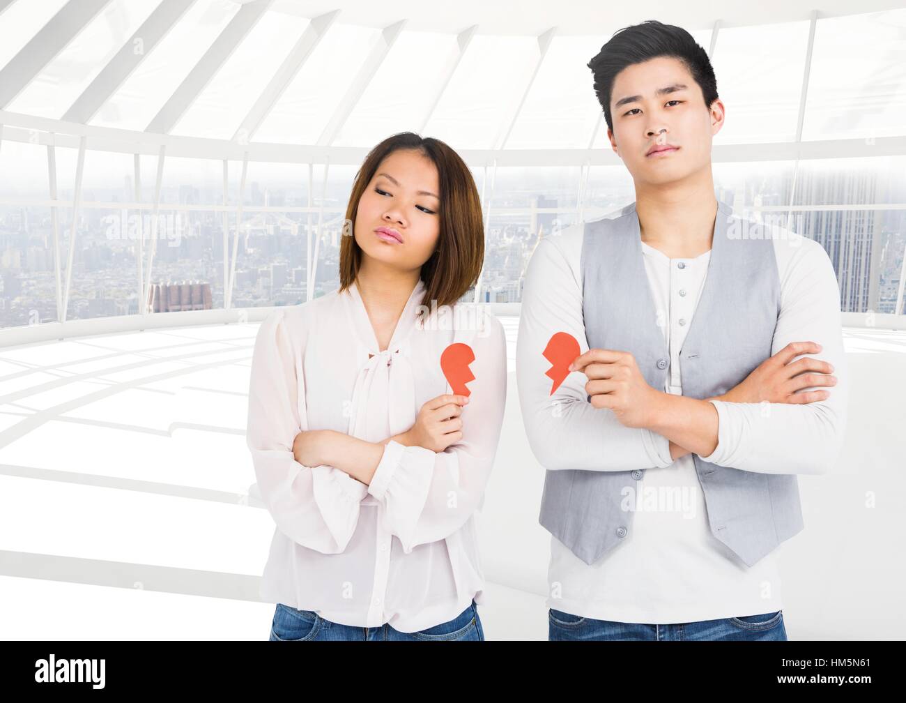 Sad couple holding broken heart Stock Photo - Alamy