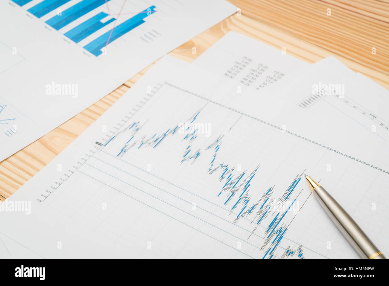 Financial charts on the table Stock Photo - Alamy