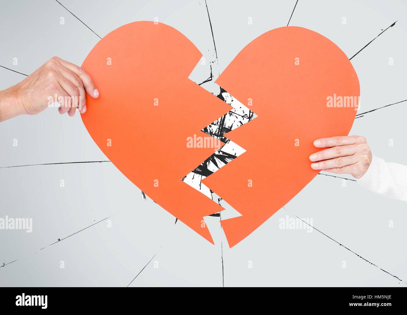 Hand of couple holding broken hearts Stock Photo - Alamy