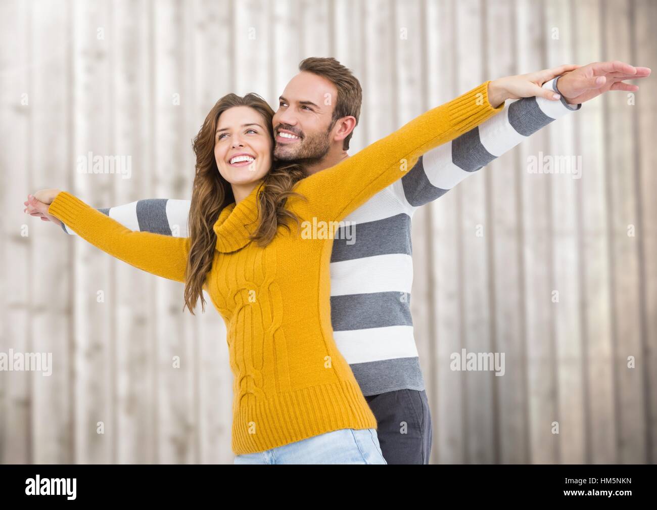 Happy couple pretending to fly Stock Photo - Alamy