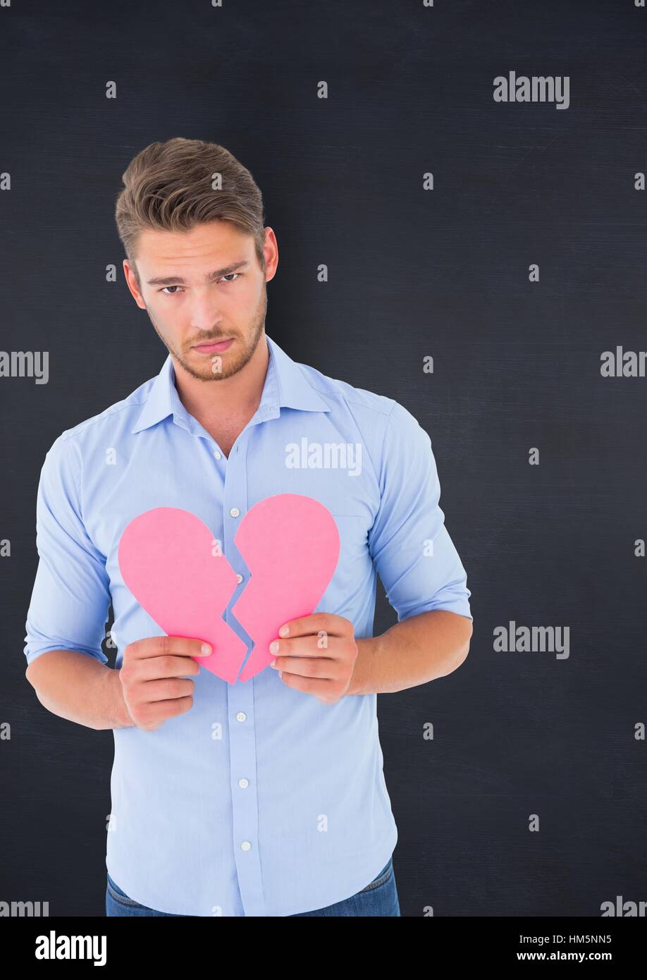 Man holding broken heart Stock Photo - Alamy
