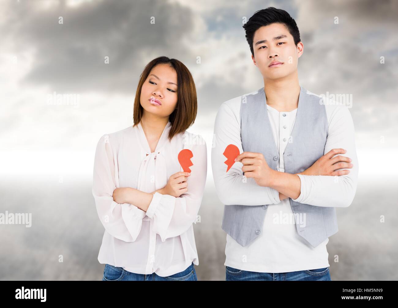 Depressed couple holding broken heart Stock Photo - Alamy