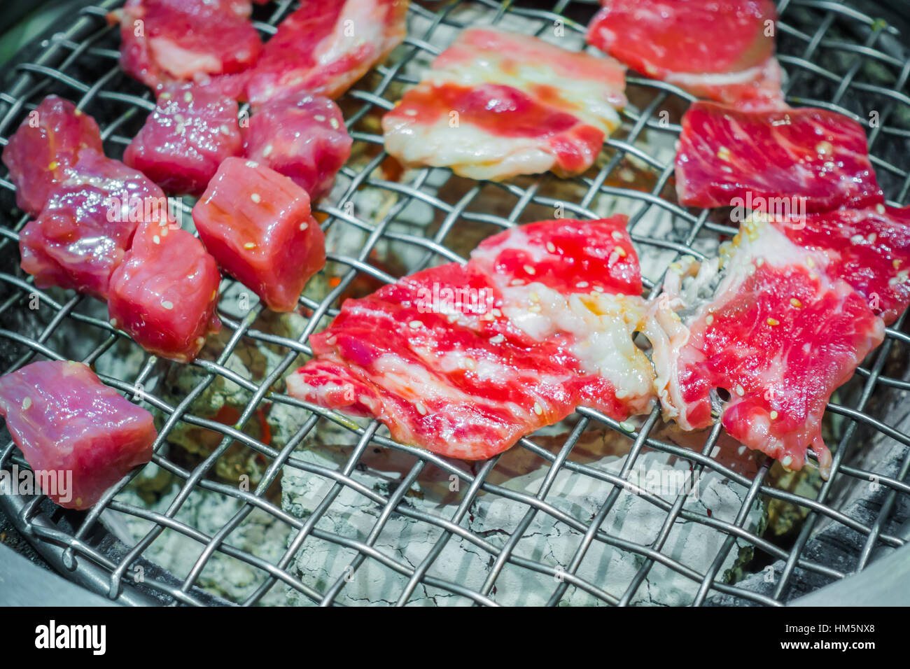 Japanese style Raw fresh beef on hot barbecue grill Stock Photo - Alamy