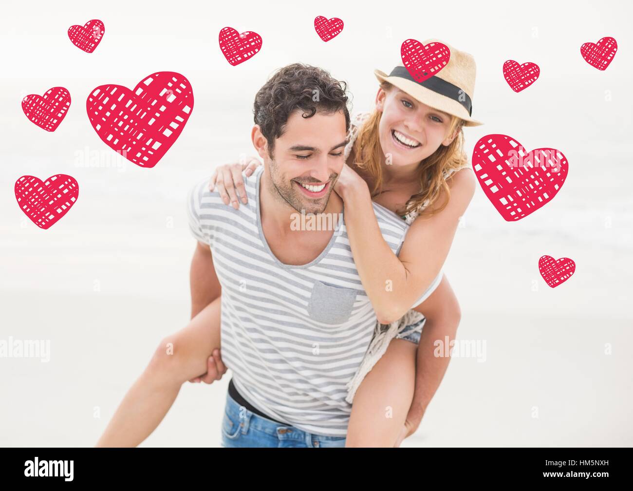 Happy man giving piggy back to woman against white background Stock ...