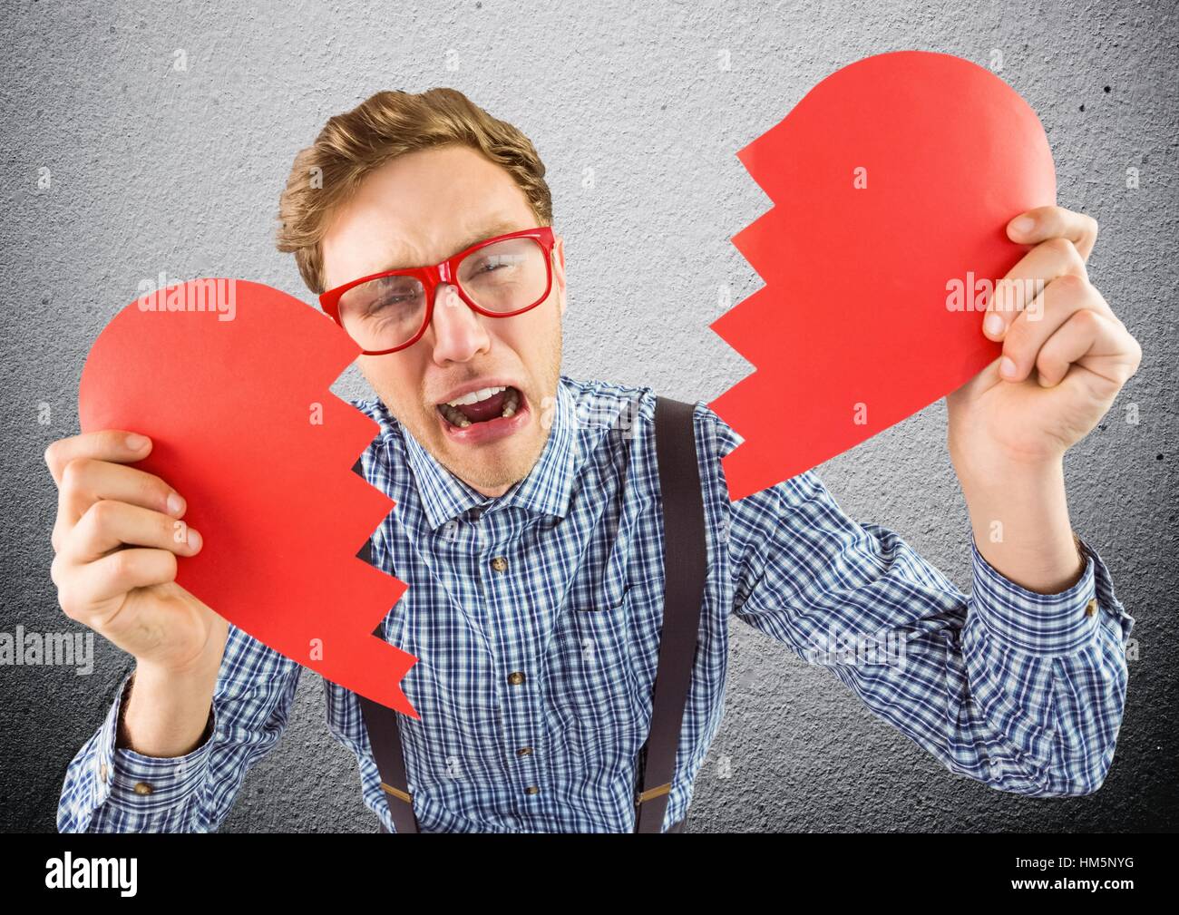 Crying man holding broken heart Stock Photo - Alamy