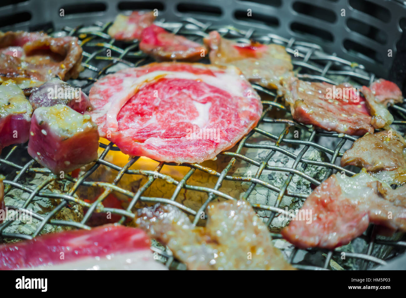 Japanese style Raw fresh beef on hot barbecue grill Stock Photo - Alamy