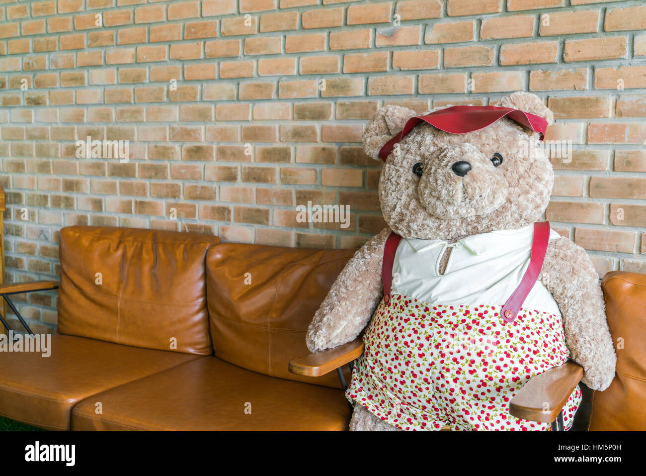 Cute teddy bear sitting on chair Stock Photo - Alamy