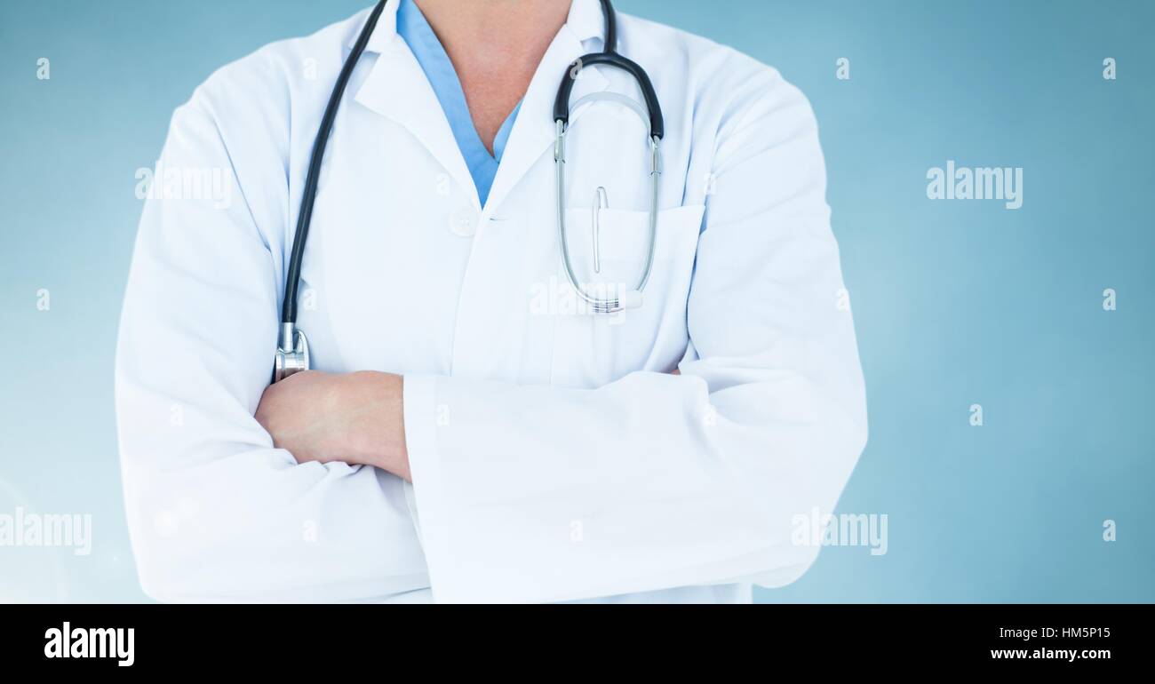 Mid section of doctor standing with arms crossed Stock Photo - Alamy