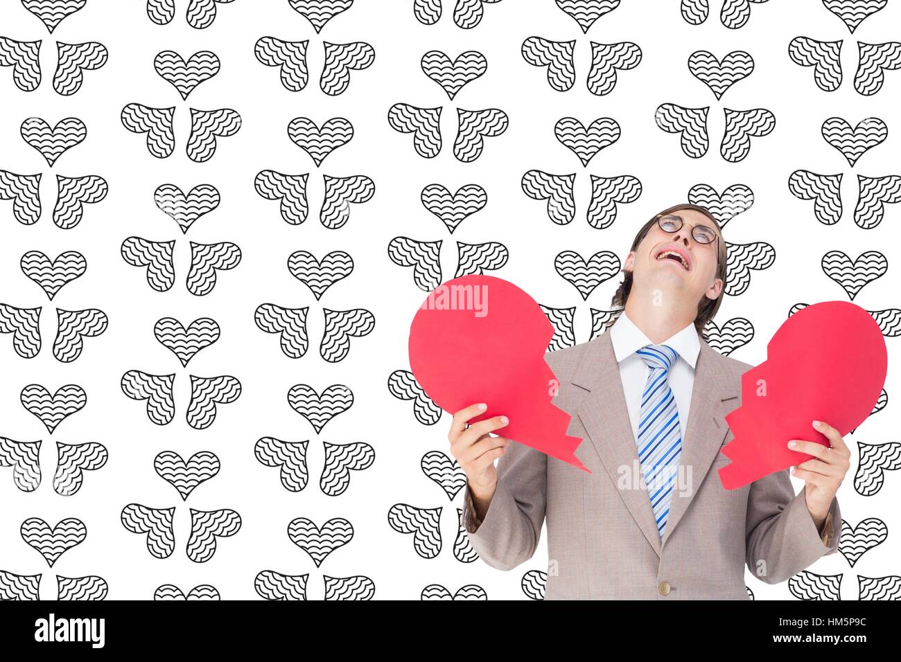 Crying businessman holding broken heart Stock Photo - Alamy