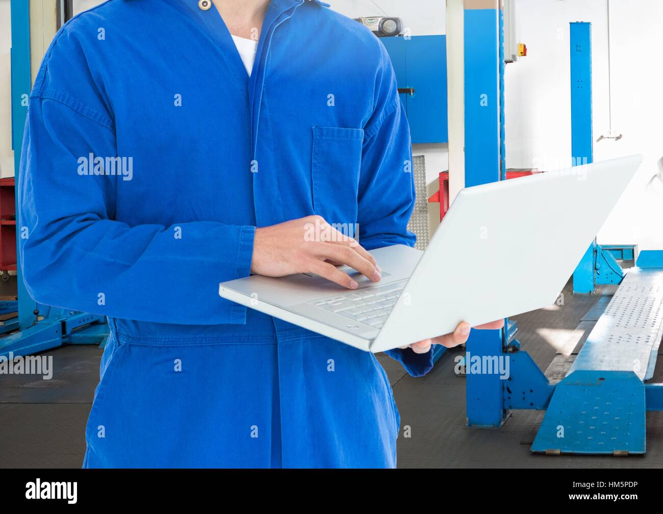 Technician using laptop machine hi-res stock photography and images - Alamy