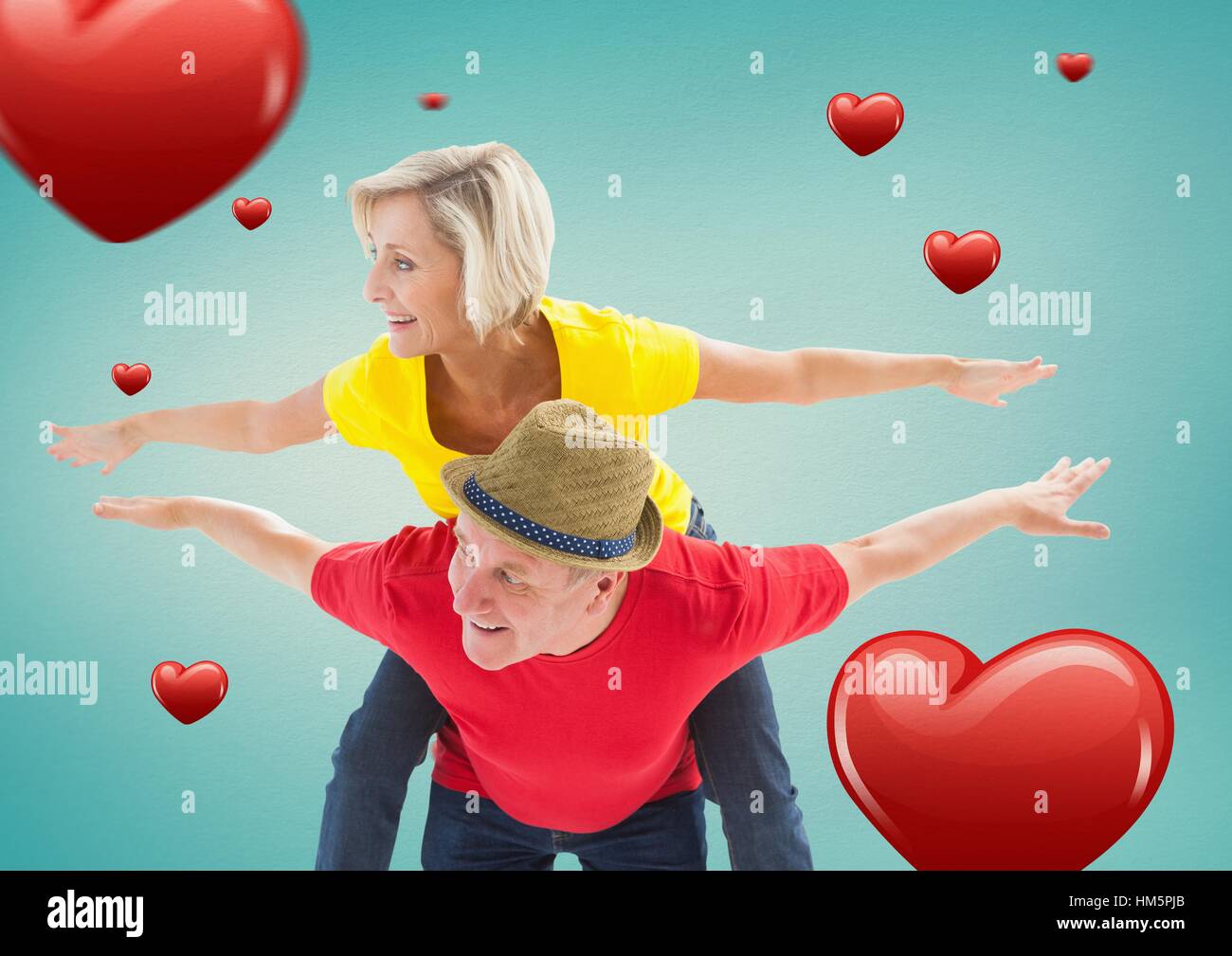 Senior man giving piggy back to woman Stock Photo - Alamy