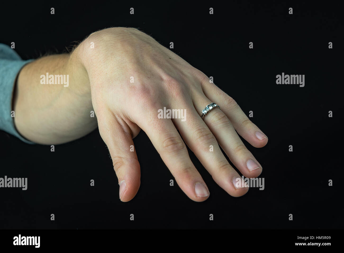 human hand showing signs. finger with diamond ring Stock Photo - Alamy