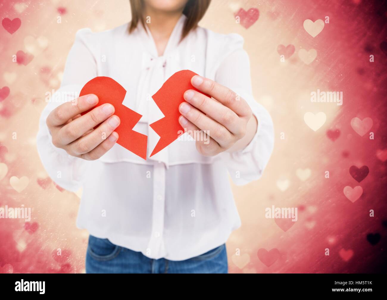 Mid-section of a woman holding a broken heart Stock Photo - Alamy