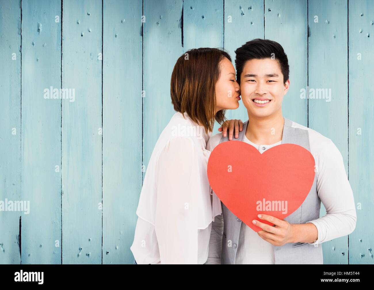 Romantic couple holding heart shape Stock Photo - Alamy