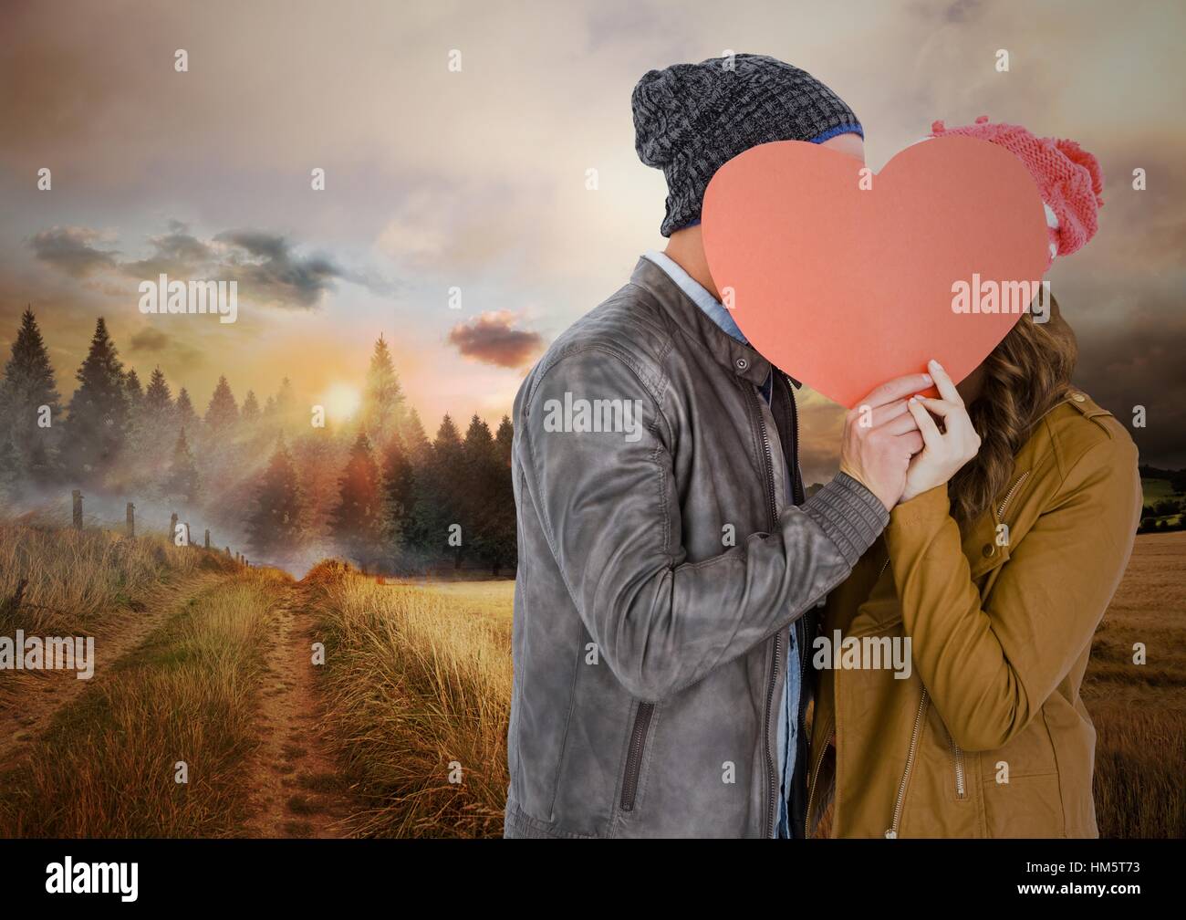 Heart behind paper showing hi-res stock photography and images - Alamy