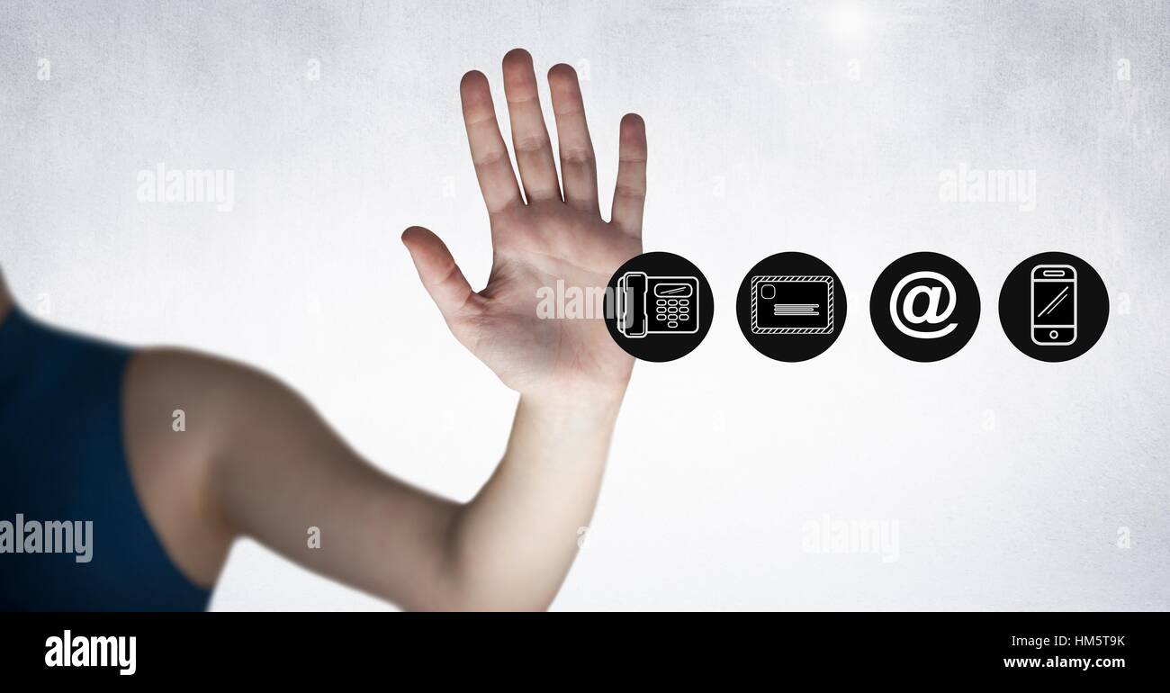 Close-up of hand beside communication icon set Stock Photo - Alamy