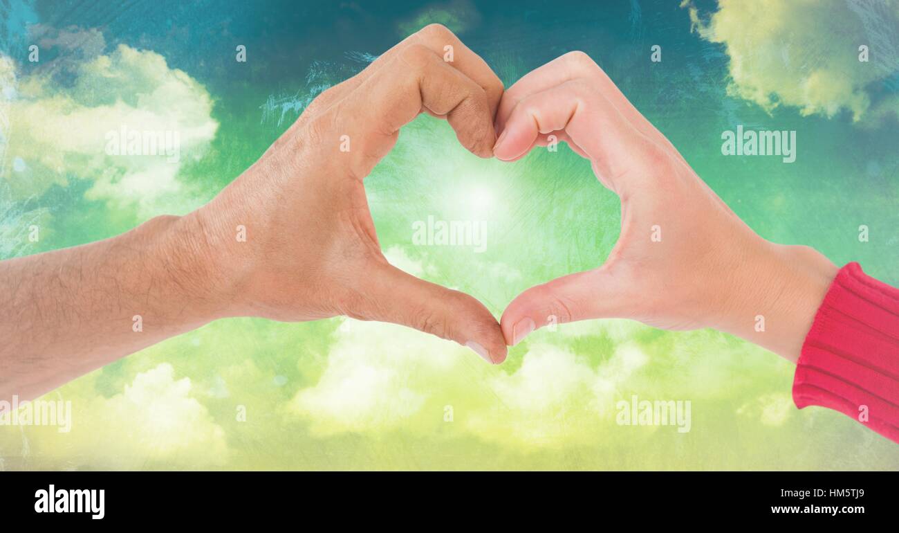 Hands of couple making heart shape Stock Photo - Alamy