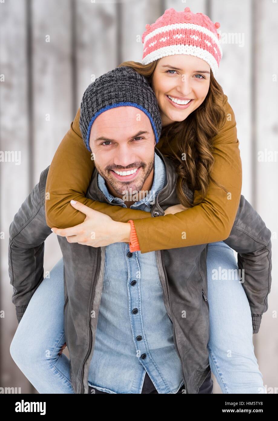 Man giving piggy back to woman Stock Photo - Alamy